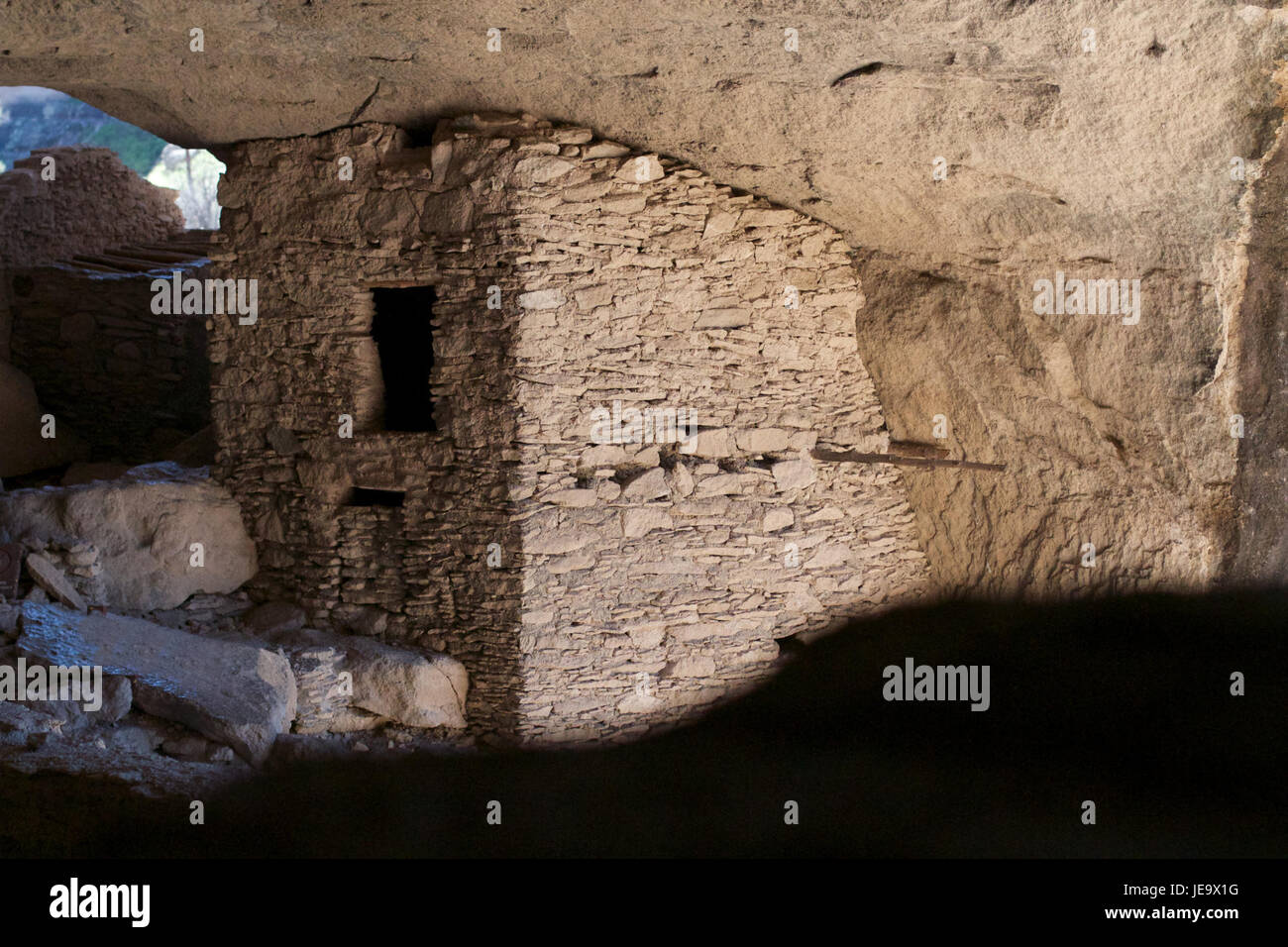 The photo titled 'Modest Living' depicts a simple and modest interior ...