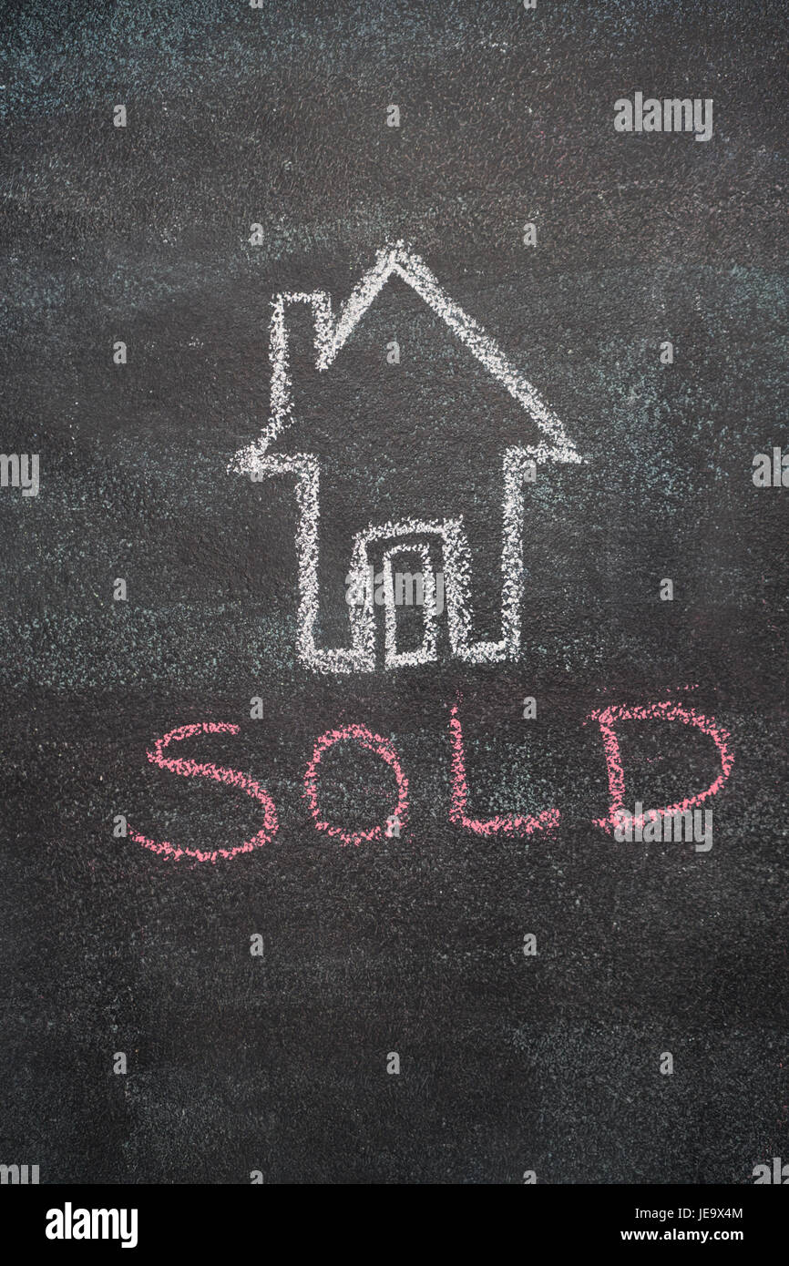 House with sold word drawn with chalk on blackboard Stock Photo - Alamy