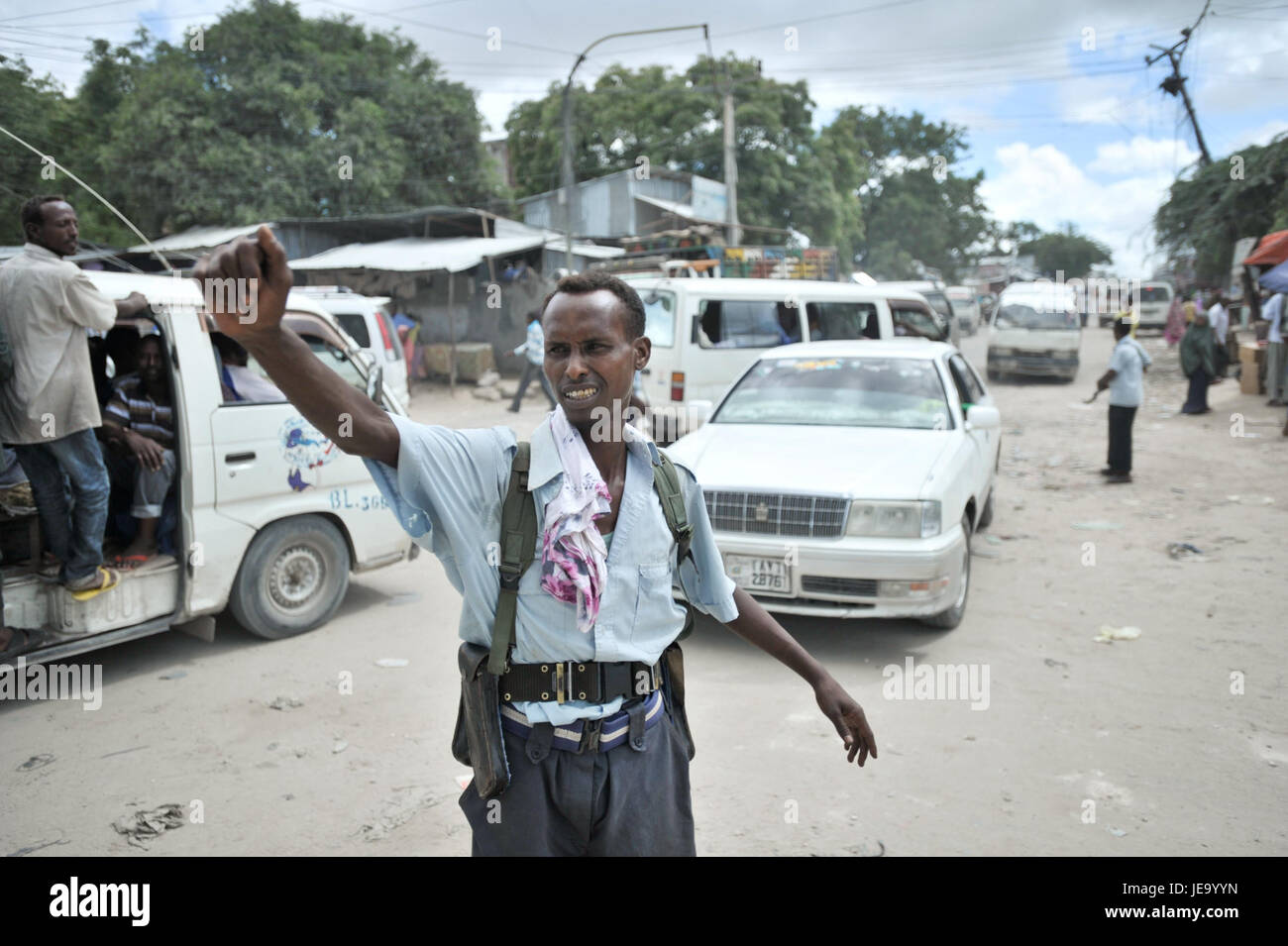 This photograph shows a police checkpoint, capturing law enforcement ...
