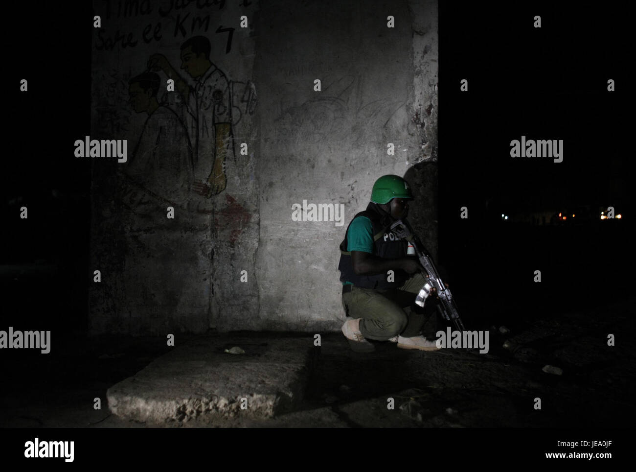 An image showing an FPU (Formed Police Unit) conducting a night patrol ...