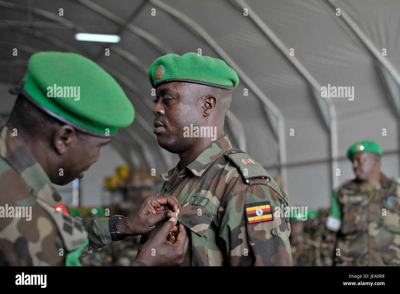 This photograph depicts a rotation of Ugandan military personnel ...