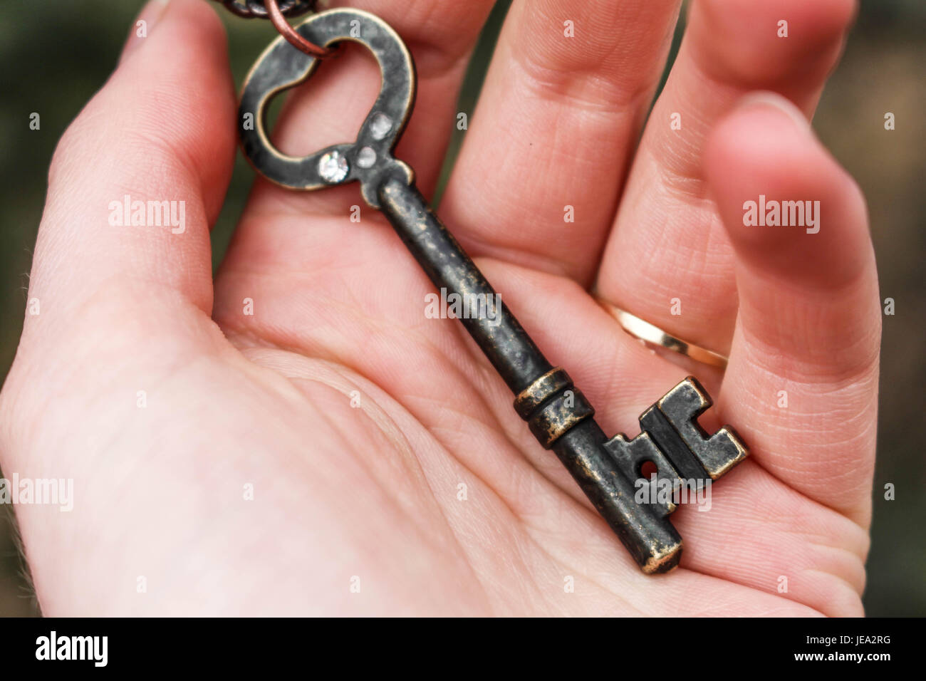 Holding the key to Stock Photo - Alamy
