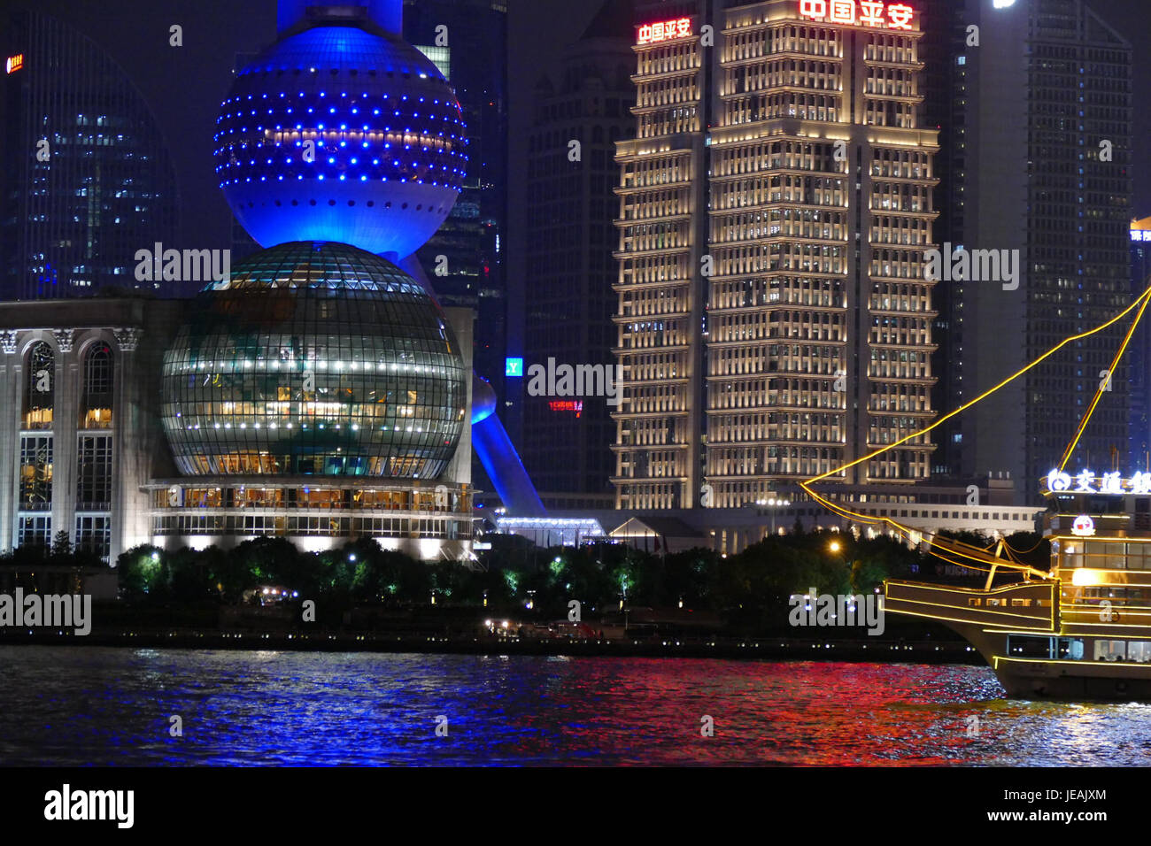 The Shanghai International Conference Center, illuminated at night, is ...