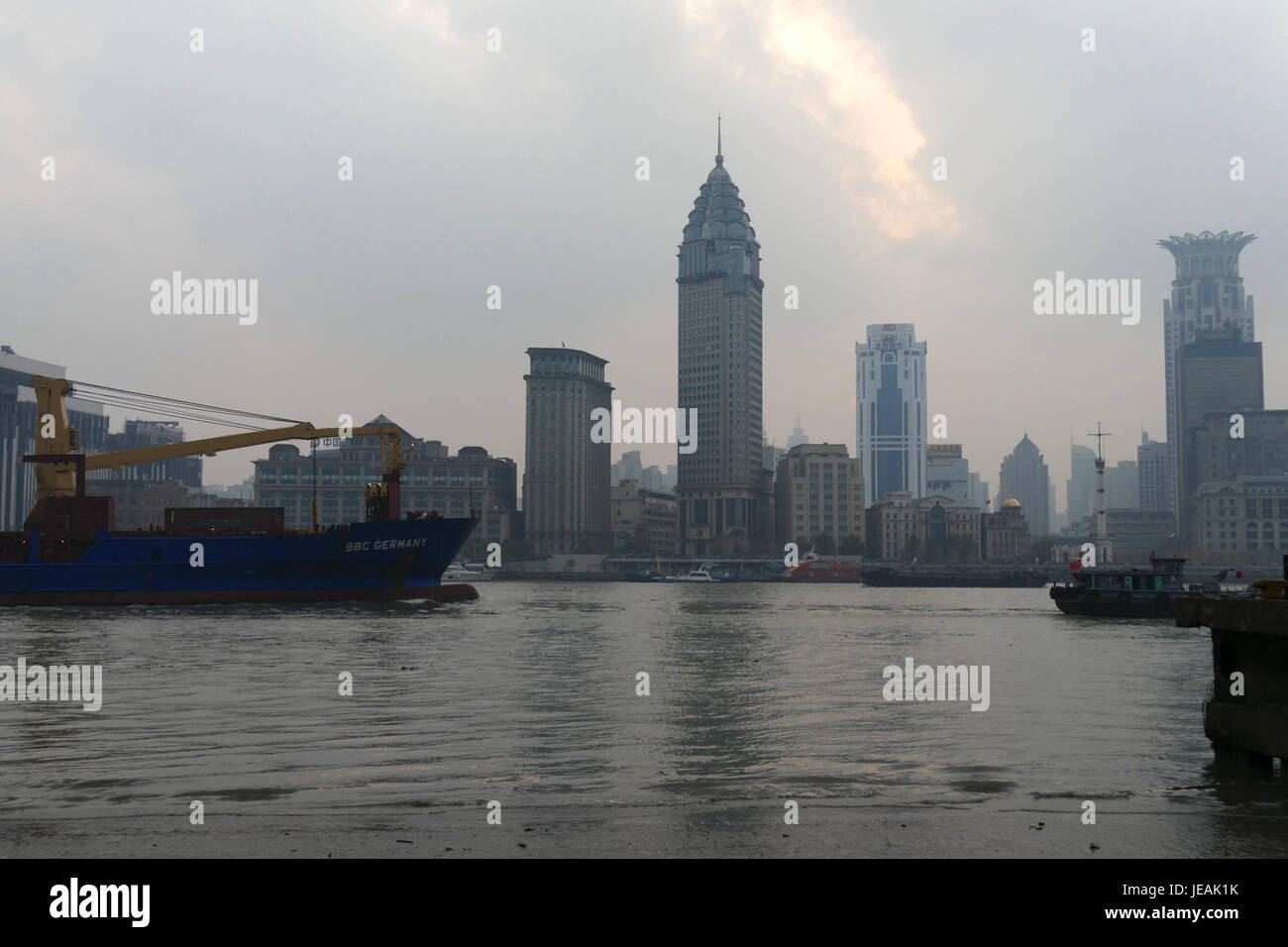 This photograph captures ships navigating the Huangpu River in Shanghai ...