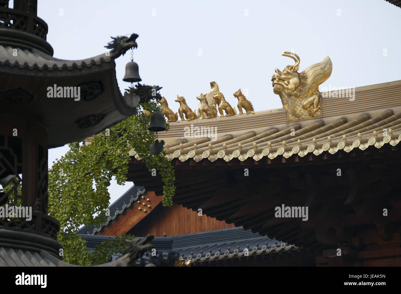 This photograph captures the Jing'an Temple, an ancient Buddhist temple ...