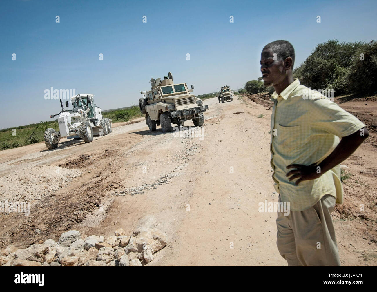 This image shows the grading process of Afgooye Road, located in ...