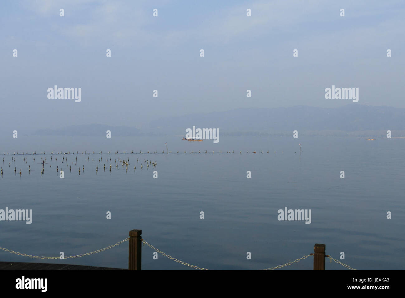 Serene lakeside view features hi-res stock photography and images - Alamy