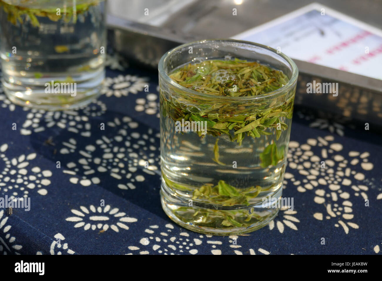 The image depicts a tea tour boat on West Lake (Xihu) in Hangzhou ...