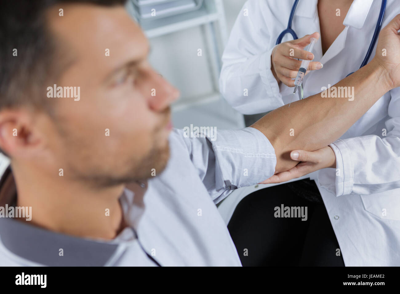doctor inject vaccine to patient Stock Photo - Alamy