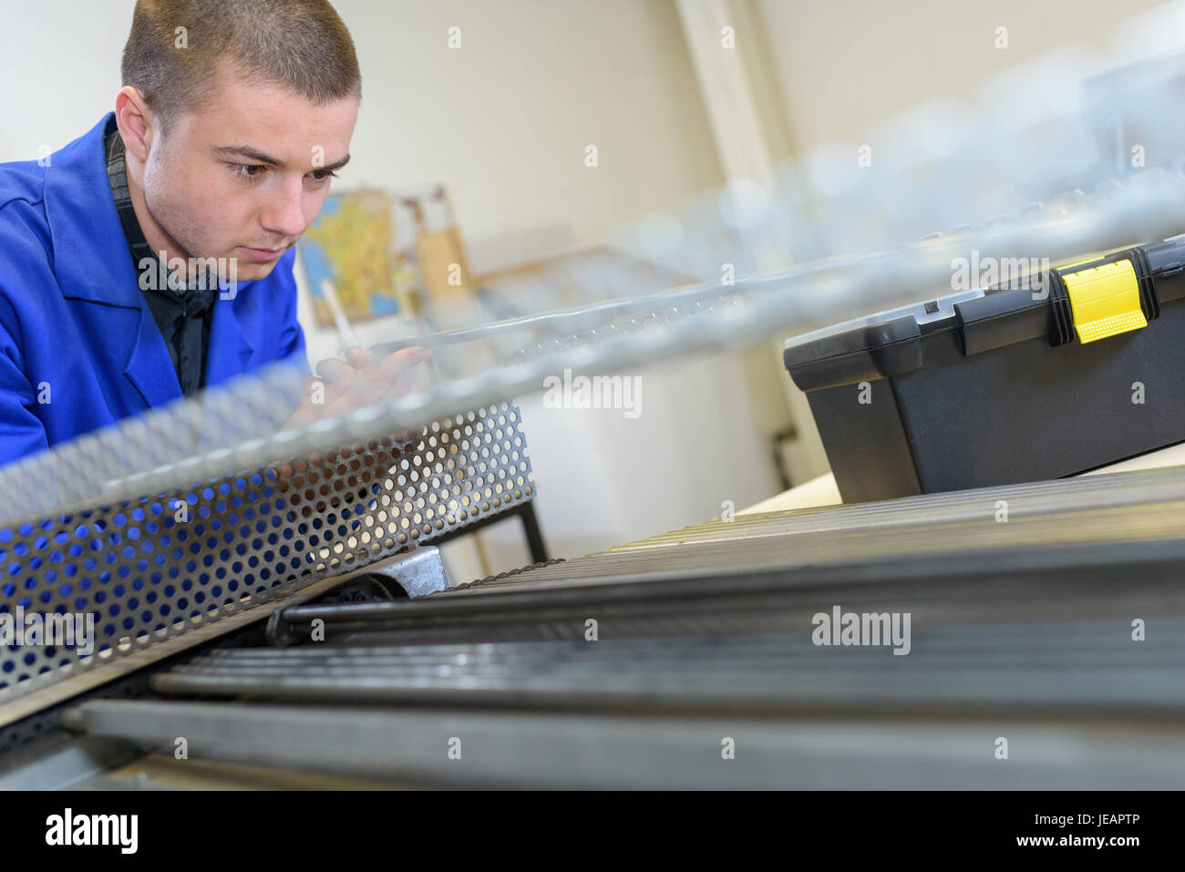 male manual worker working at metal industry Stock Photo - Alamy