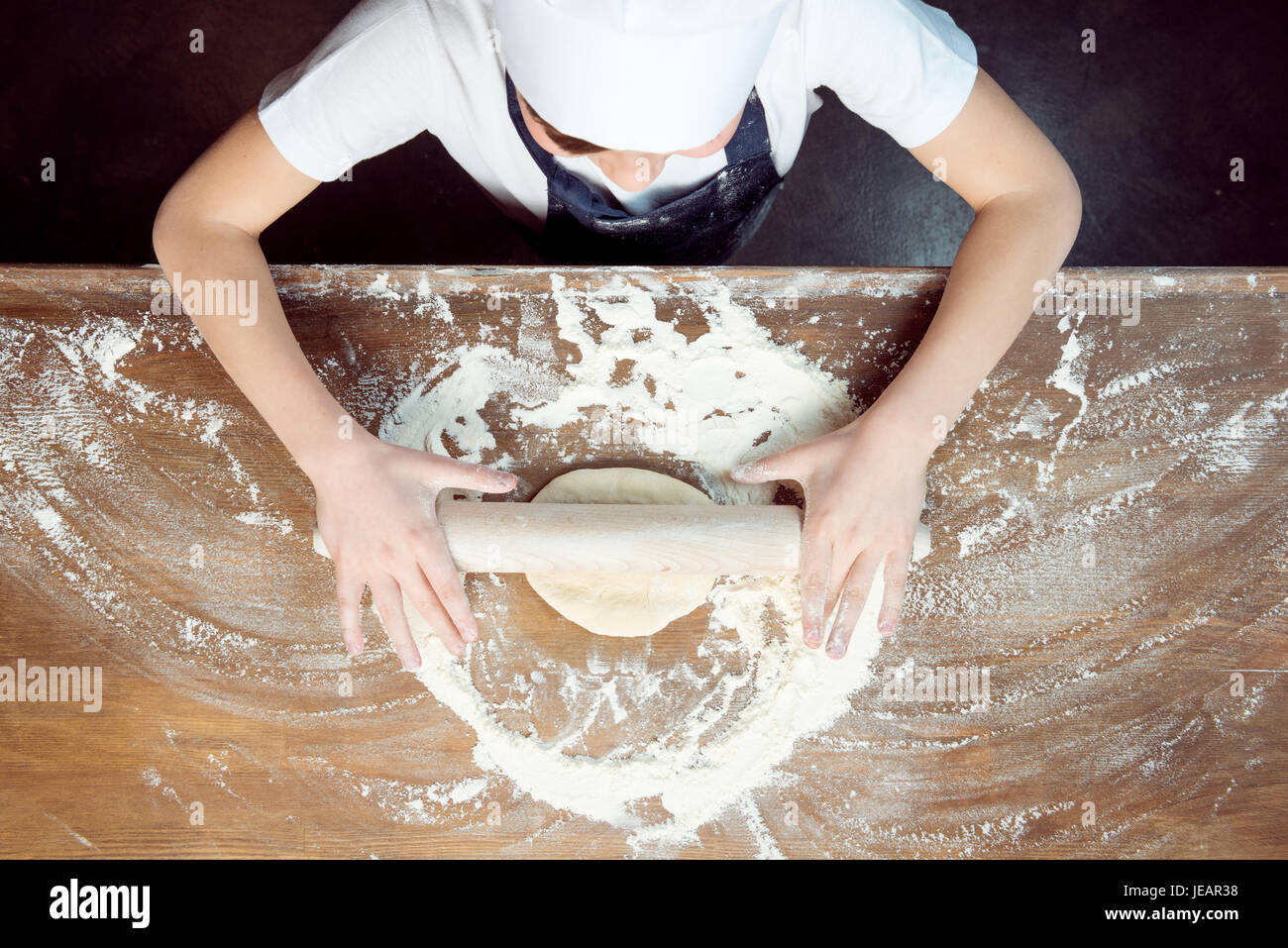 top view of child making pizza dough on wooden tabletop Stock Photo - Alamy