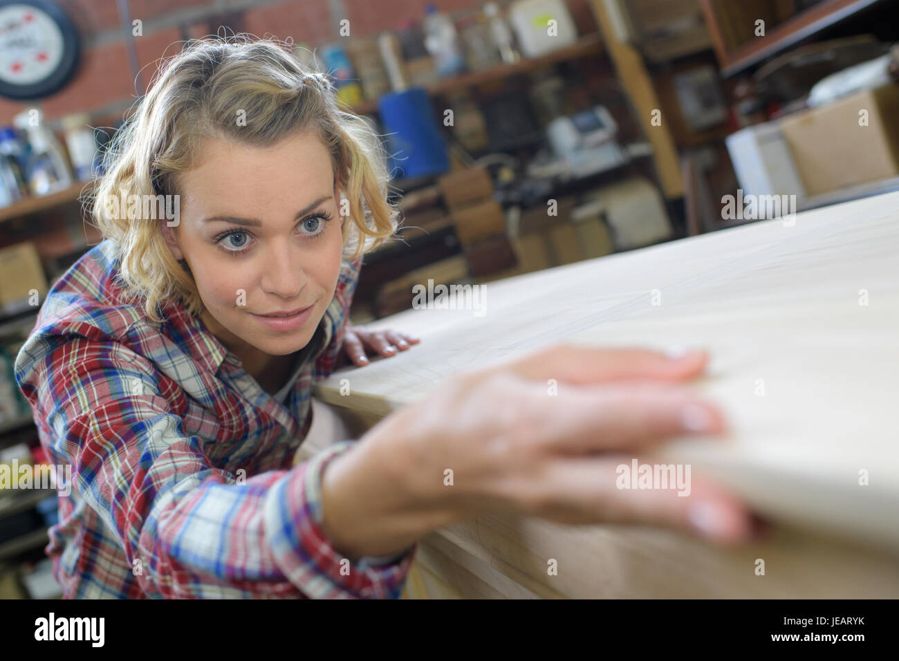 beautiful woman carpenter working in her workshop Stock Photo - Alamy
