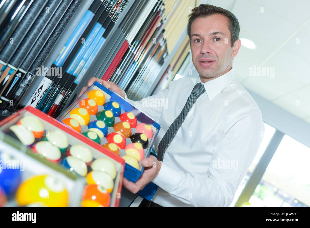 billiard shop and shop assistant Stock Photo - Alamy