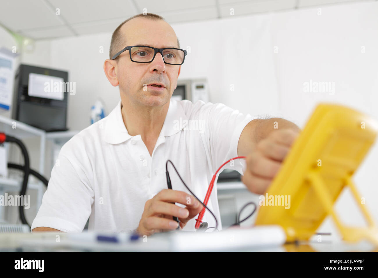 electrician working on an electric meter Stock Photo - Alamy