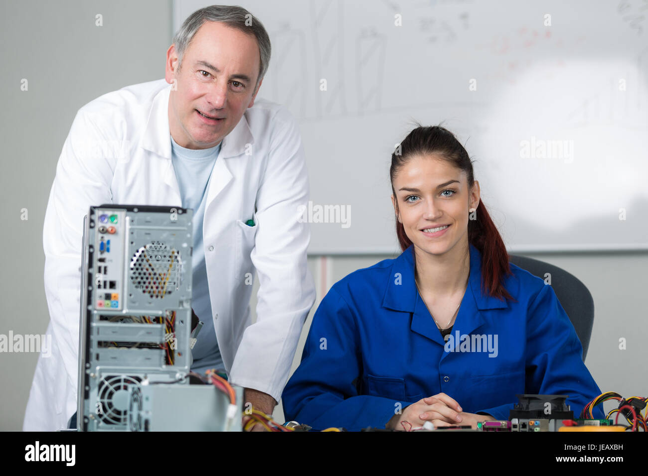 confident student and informatics teacher Stock Photo - Alamy