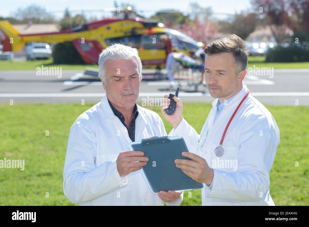 team of rescuers paramedic doctor and pilot Stock Photo - Alamy