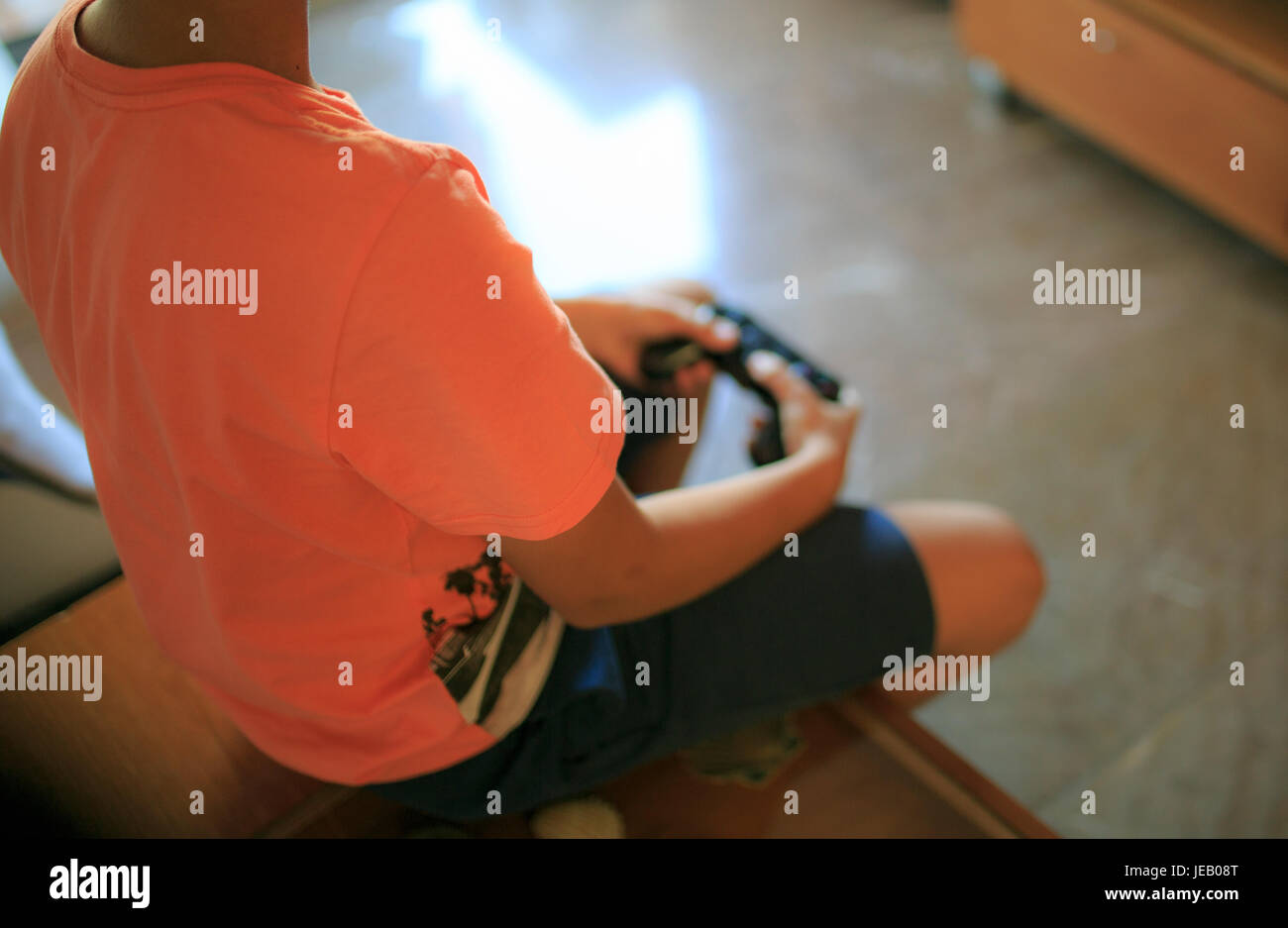 boy playing video game console Stock Photo - Alamy