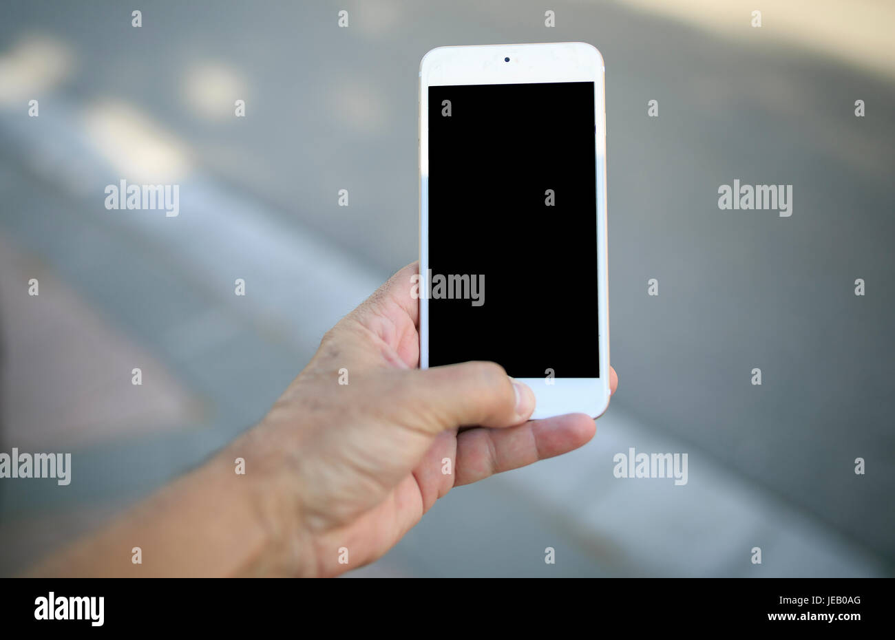 Mobile phone in a hand Stock Photo - Alamy