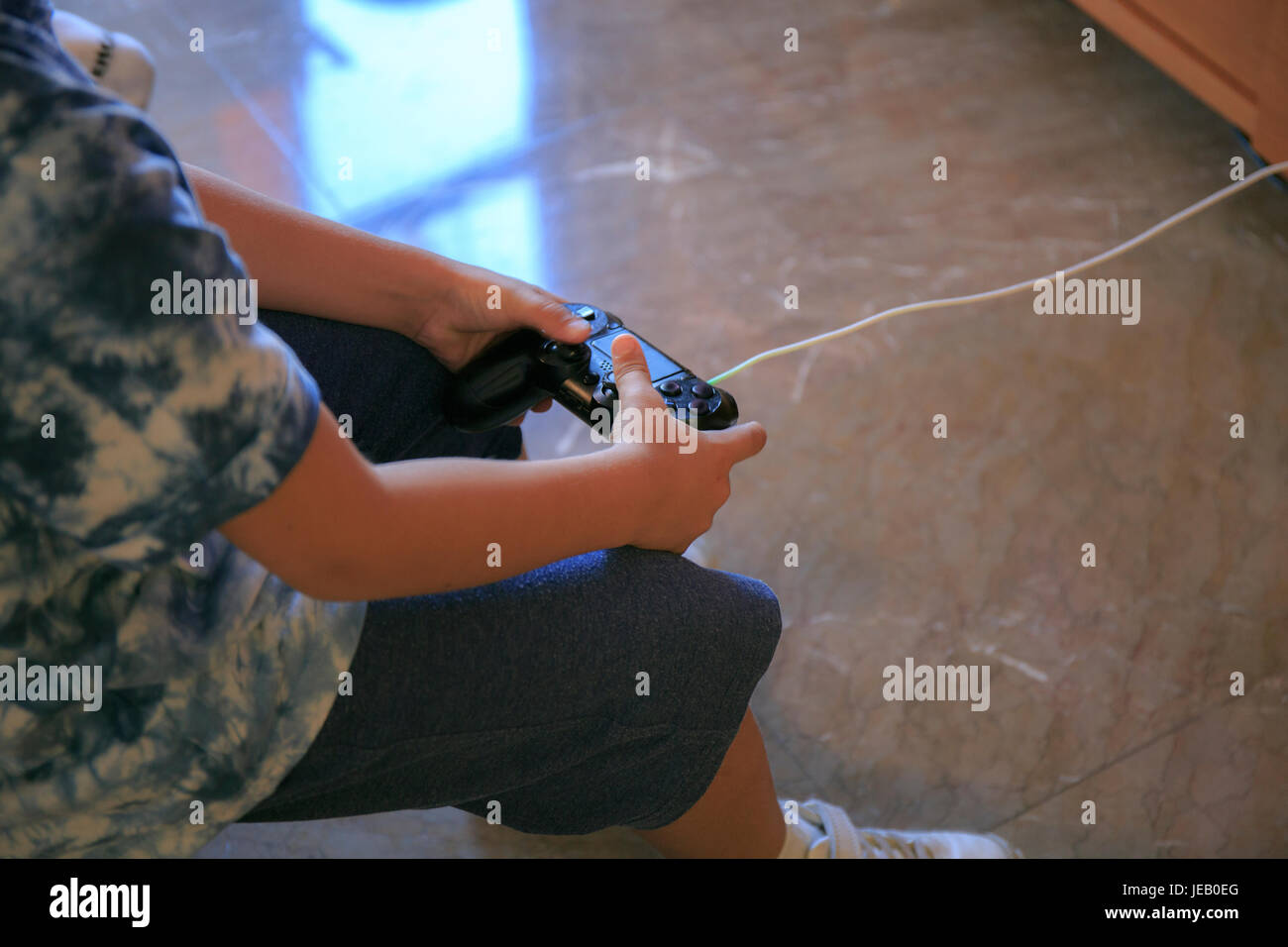 boy playing video game console Stock Photo - Alamy