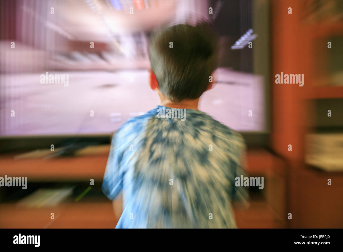 boy playing video game console Stock Photo - Alamy