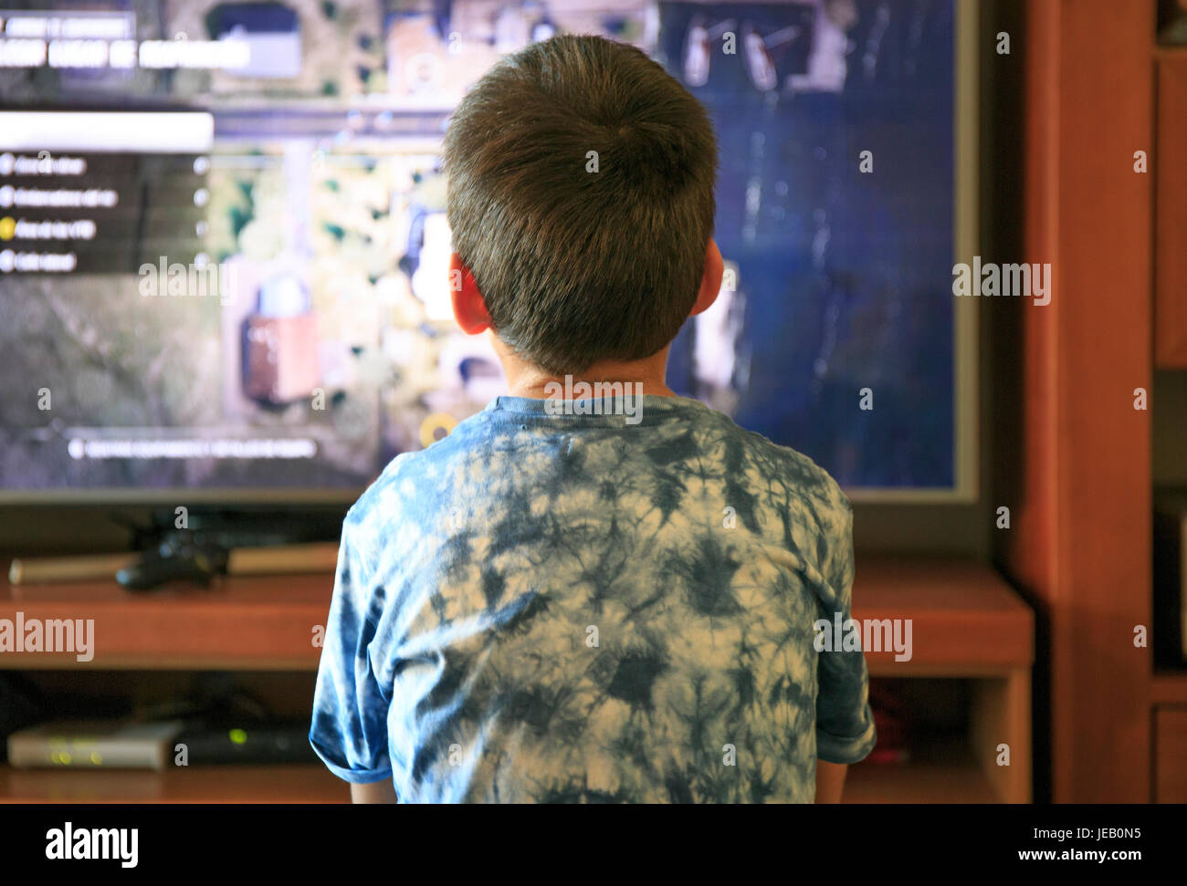 boy playing video game console Stock Photo - Alamy