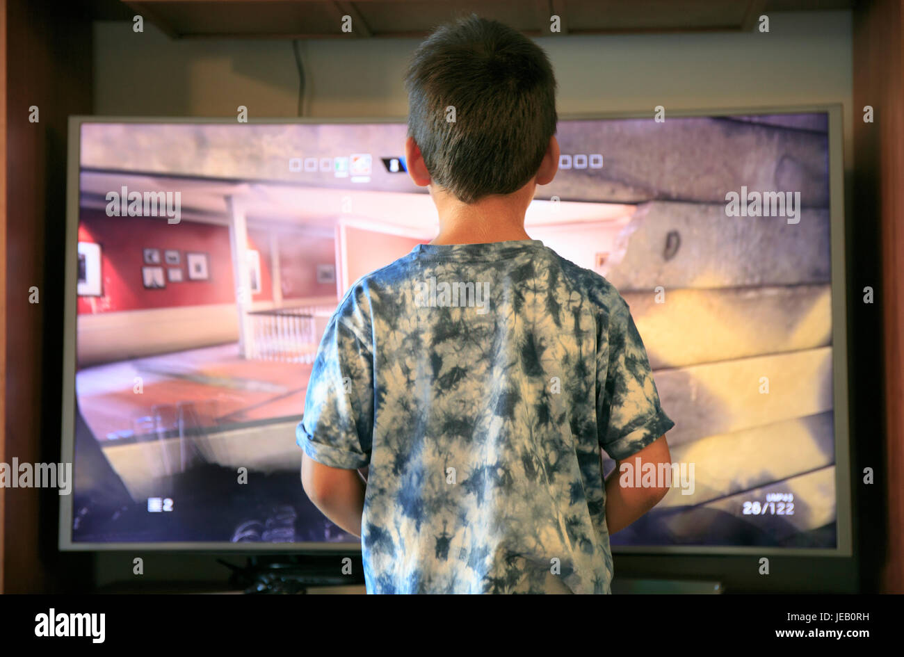 boy playing video game console Stock Photo - Alamy