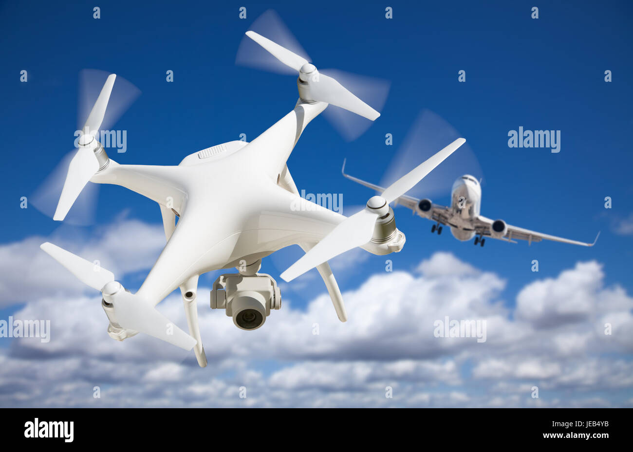 Unmanned Aircraft System (UAV) Quadcopter Drone In The Air Too Close To ...