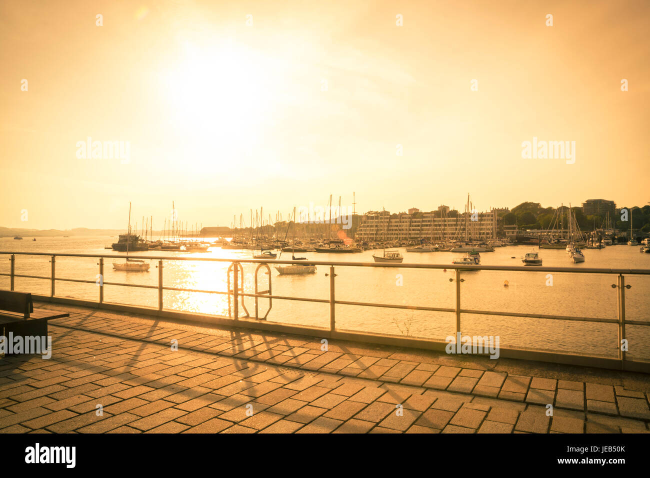 boats sunset in sea Plymouth devon Stock Photo - Alamy