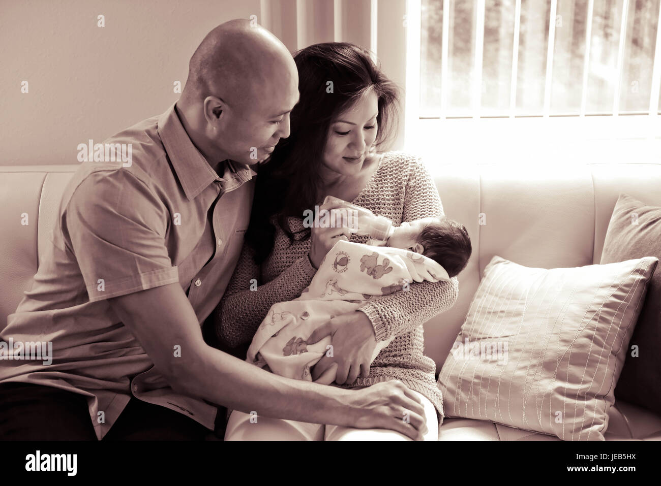 Asian parents and baby feeding hi-res stock photography and images - Alamy