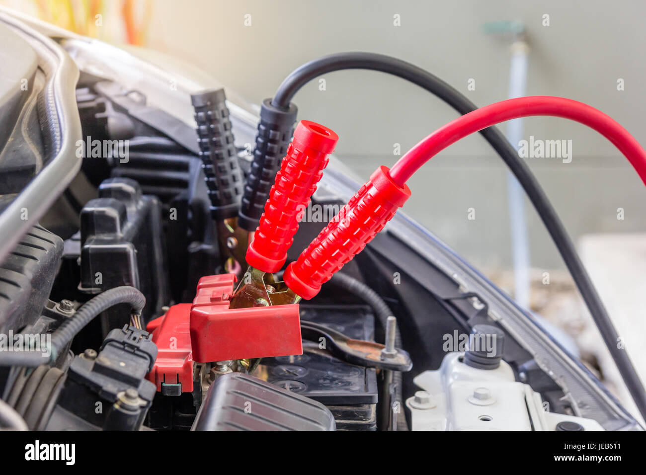 Charging car with electricity trough cables, Selective focus Stock ...