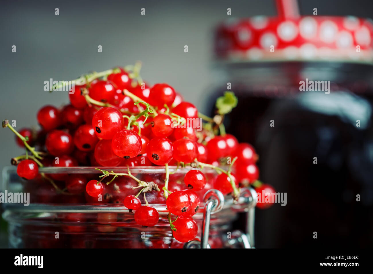 Ripe red currant and black currant juice on a wooden table. Summer ...
