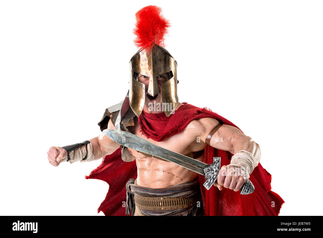 Ancient warrior or Gladiator posing over a white background Stock Photo ...