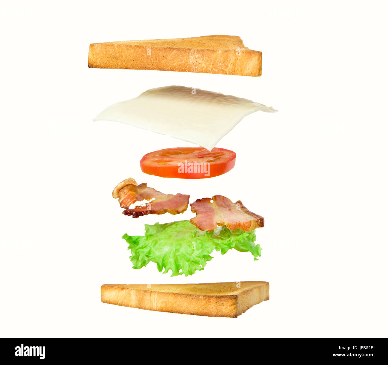 Fresh sandwich with flying ingredients isolated on white background ...