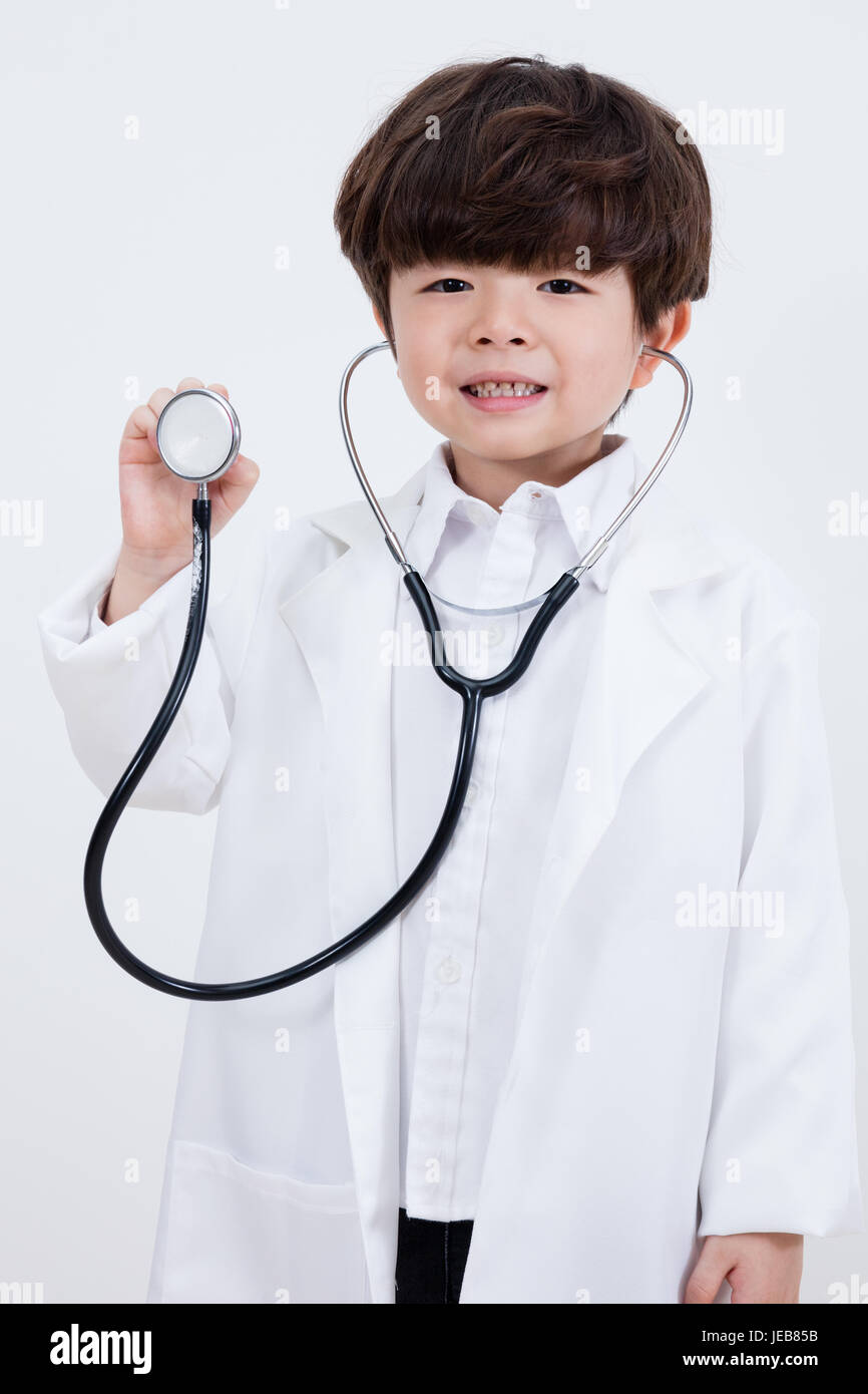 Asian Chinese little boy wearing doctor uniform with stethoscope in ...