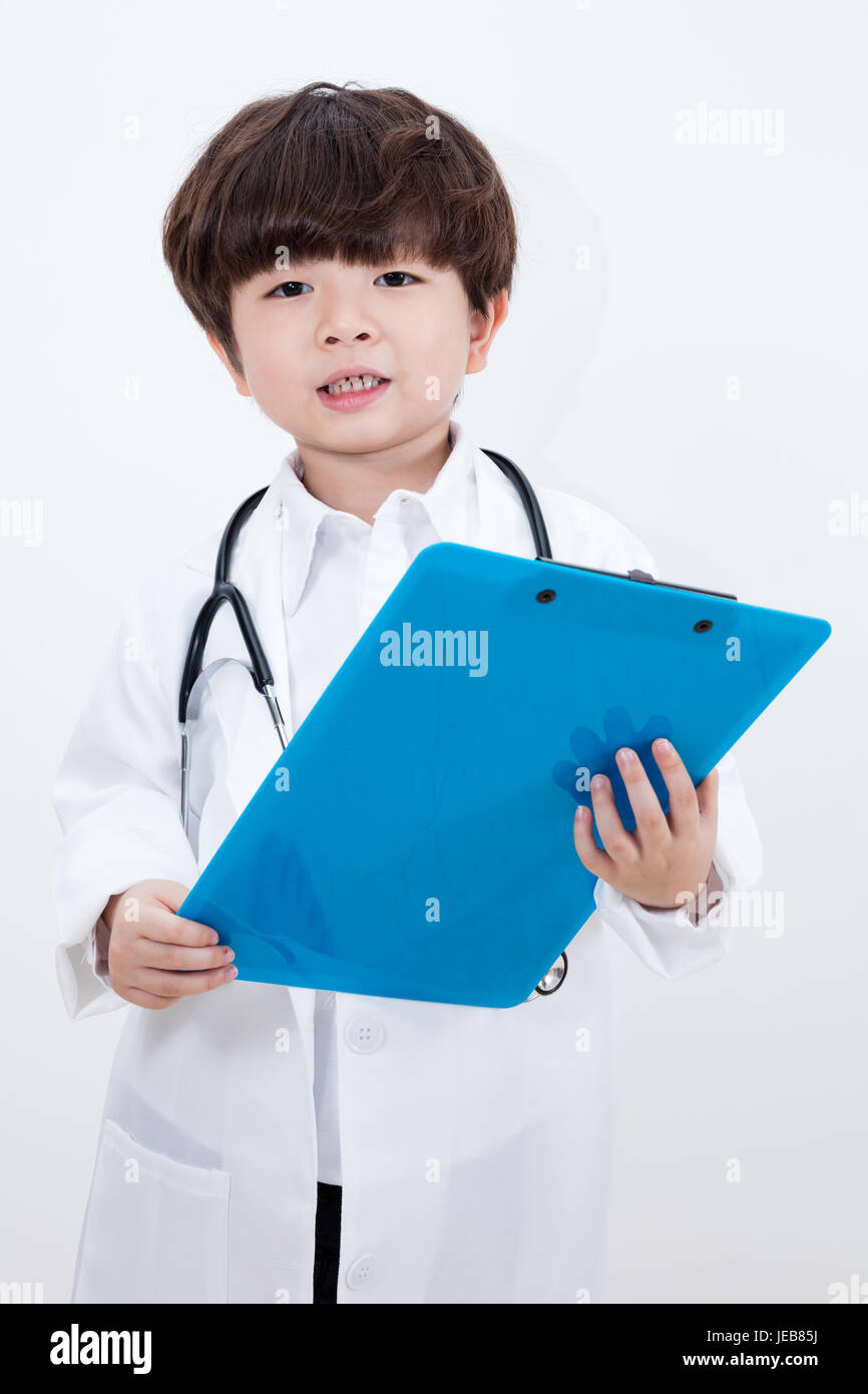 Asian Chinese little boy wearing doctor uniform with stethoscope in ...