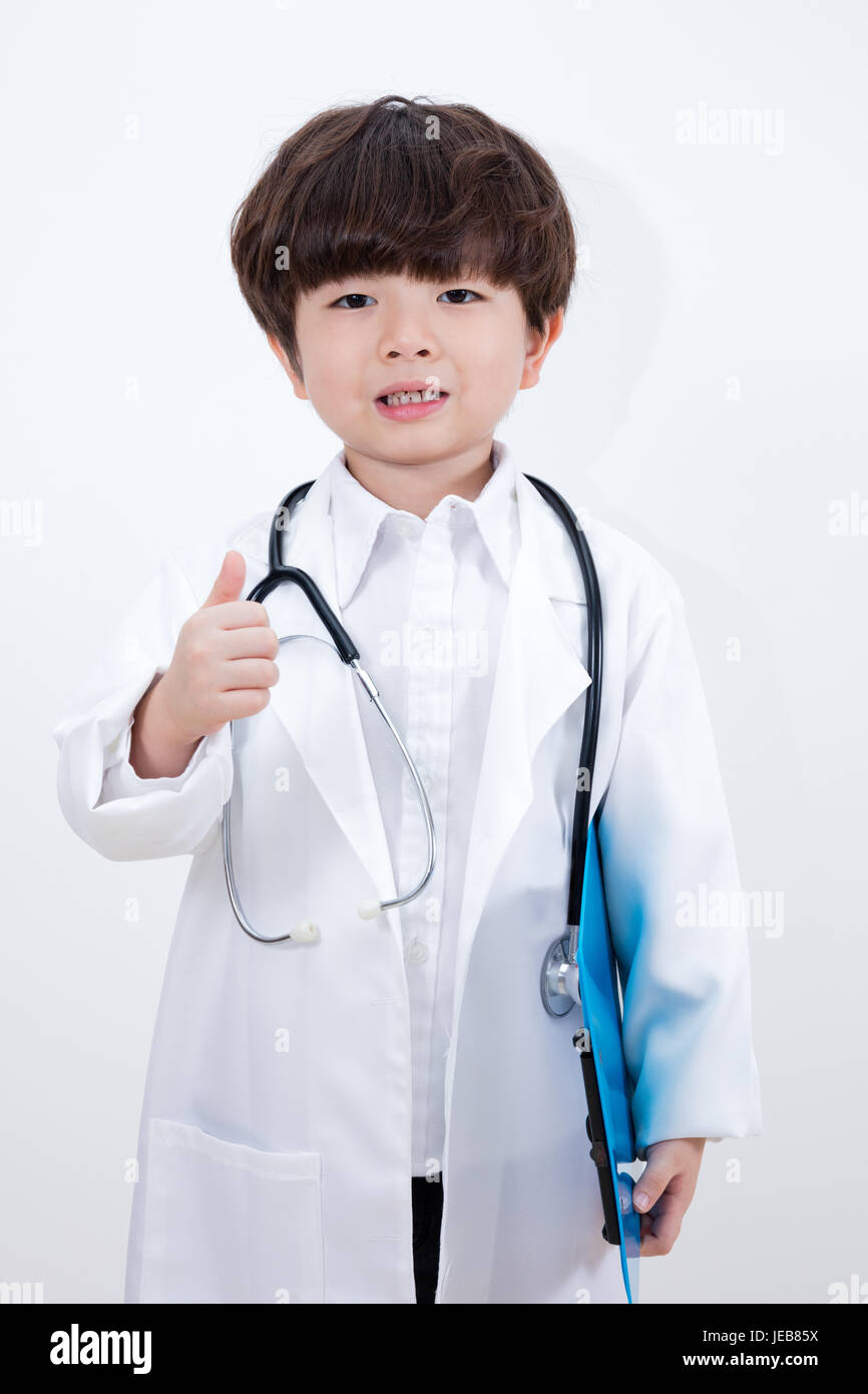 Asian Chinese little boy wearing doctor uniform with stethoscope in ...