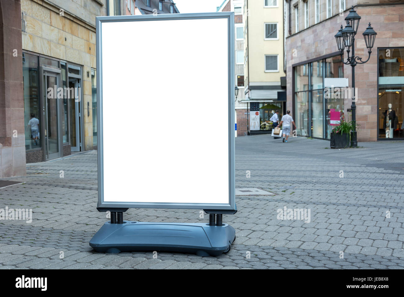 A blank ad space sign isolated in the street Stock Photo - Alamy