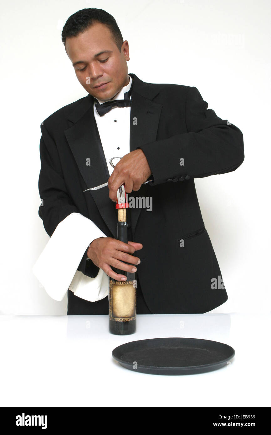 Waiter serving wine Stock Photo - Alamy