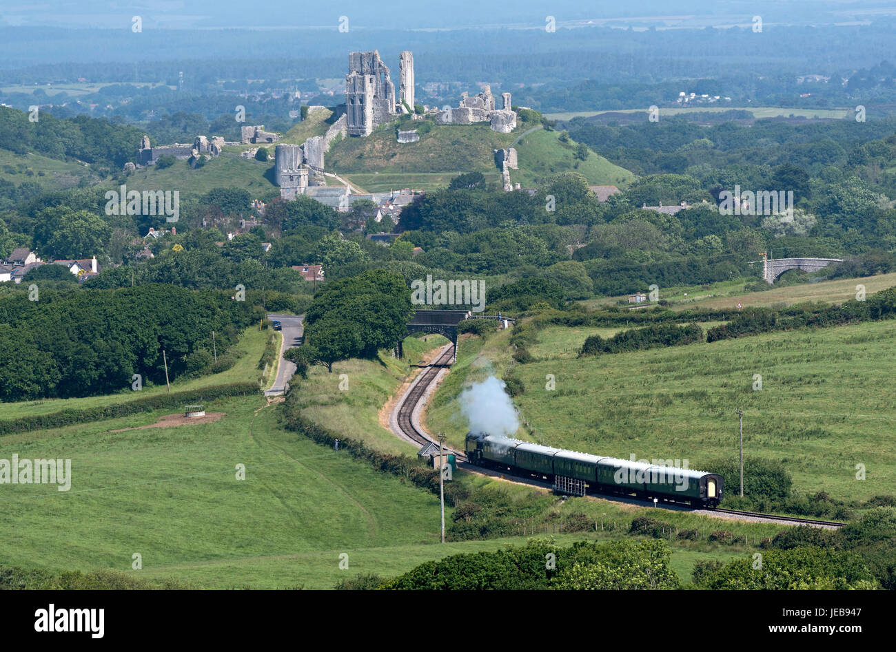 Steam train with a backdrop of Corfe Castle on the Swanage Railway in ...