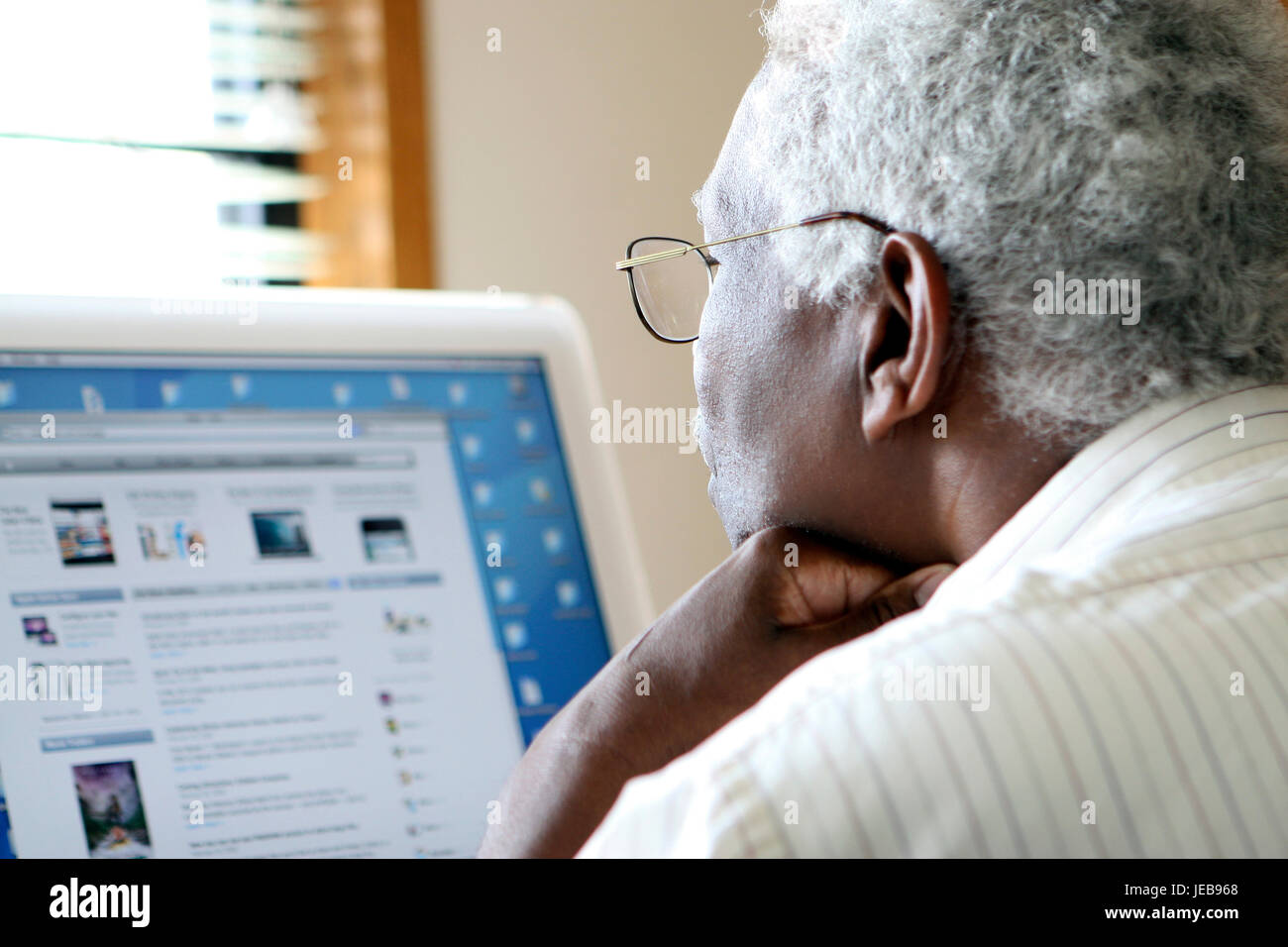 Elderly man on computer Stock Photo - Alamy