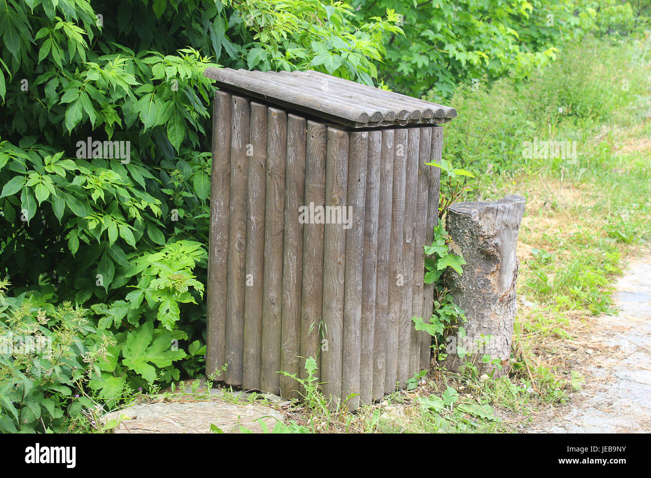 a garbage cans made with wood Stock Photo - Alamy