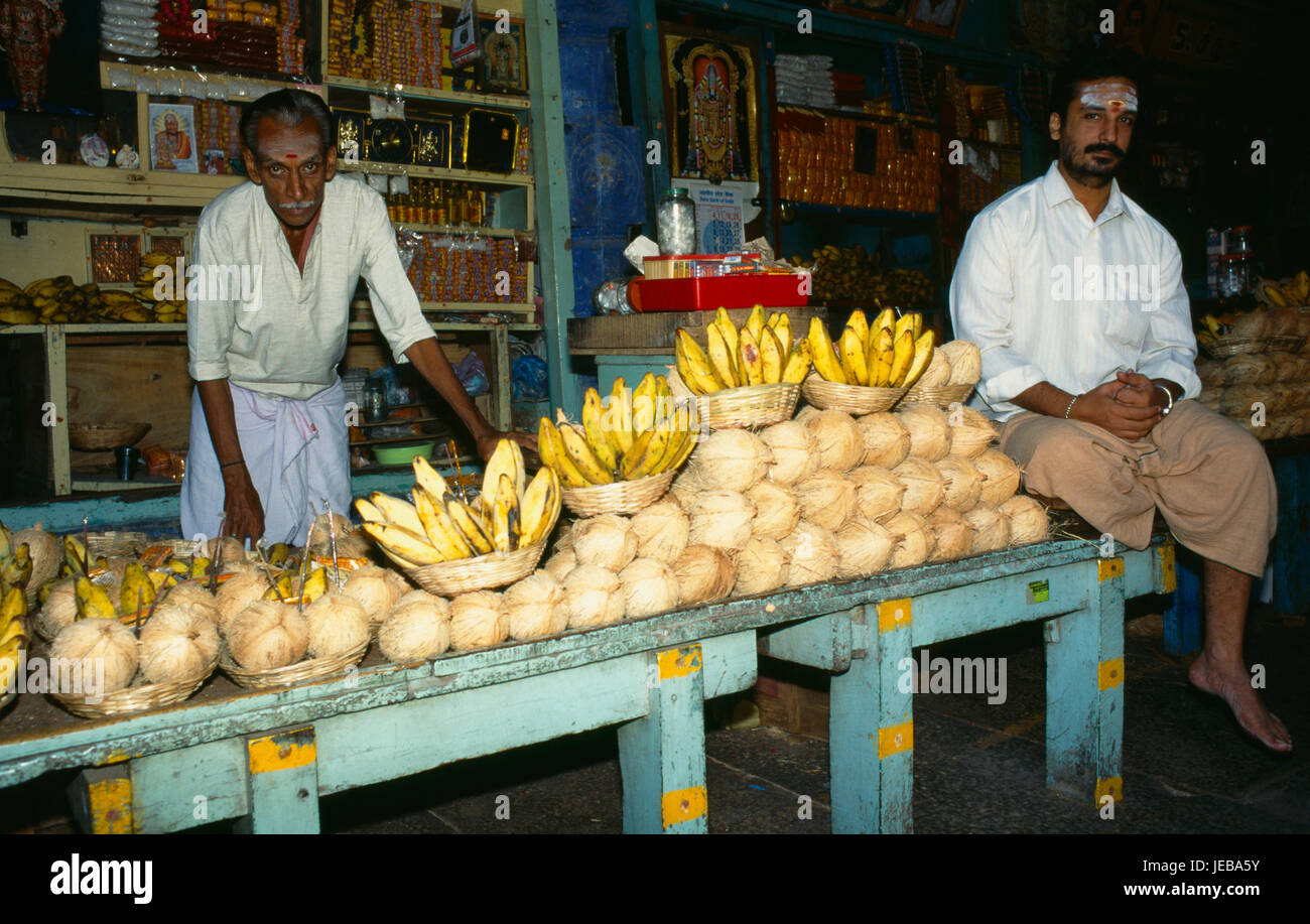 India, Hindu temple offerings with men standing by Stock Photo - Alamy