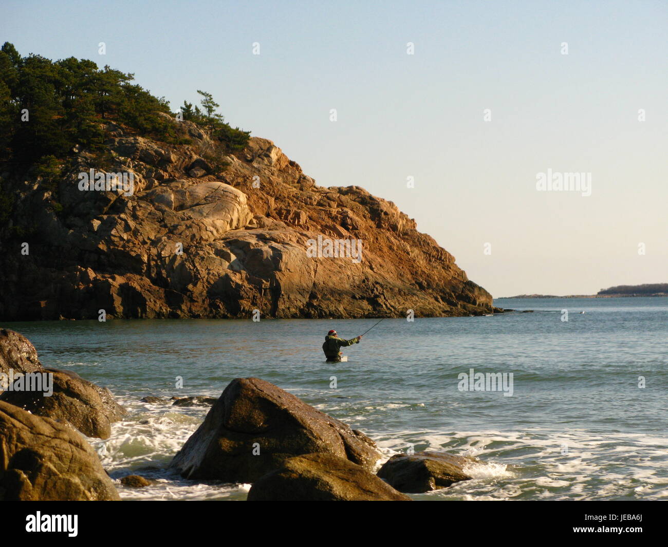 Fisherman in the sea Stock Photo - Alamy