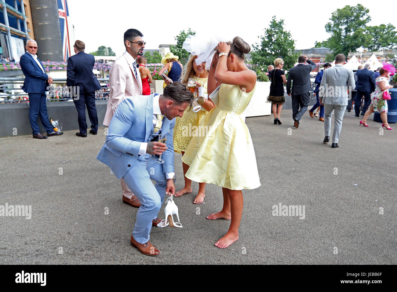 Female racegoers appear barefooted hi-res stock photography and images ...