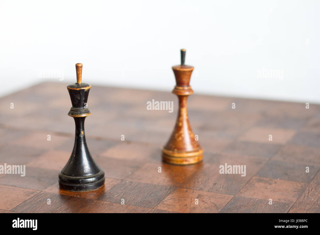 Ancient wooden chess pieces on an old chessboard Stock Photo - Alamy