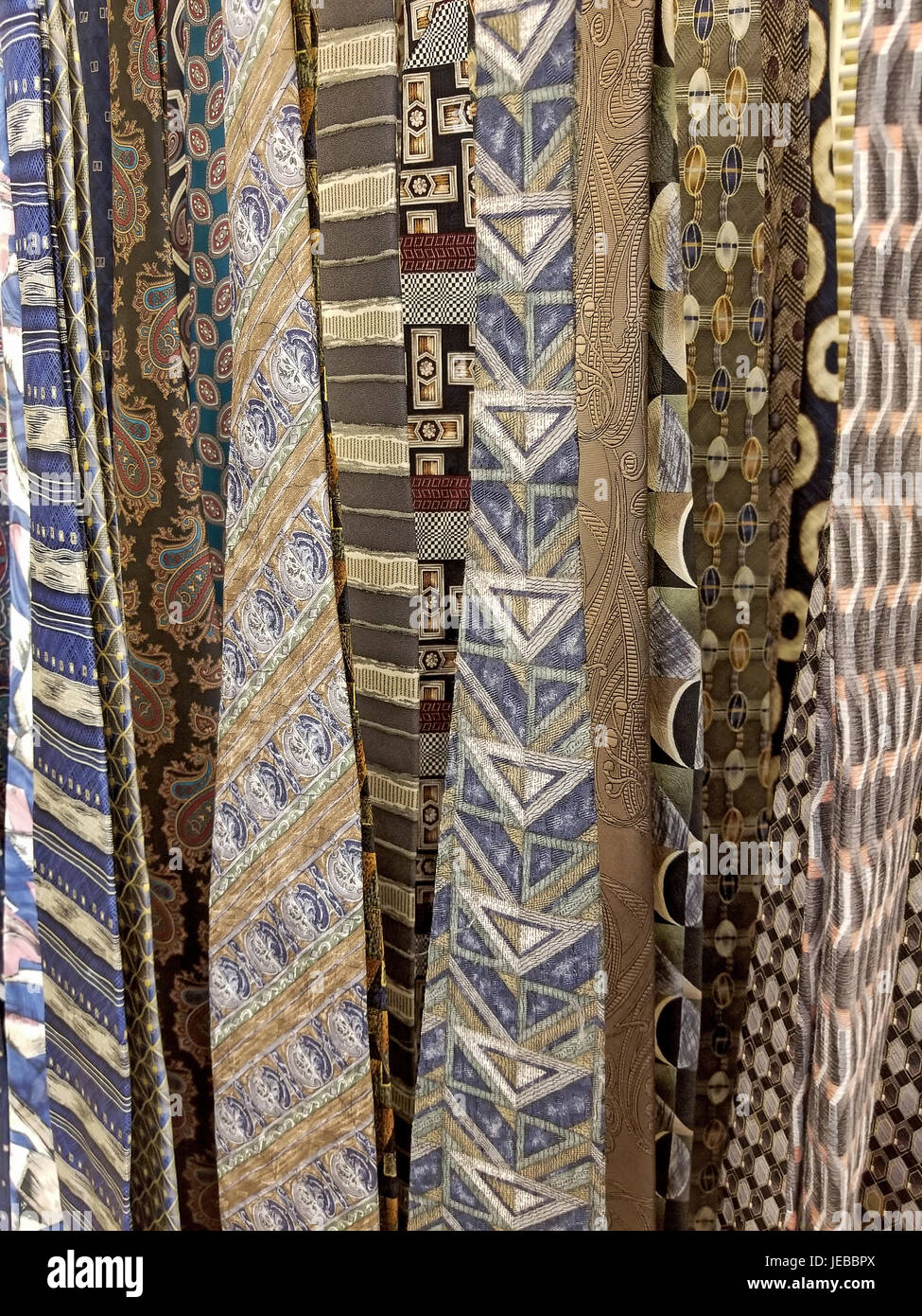 collection of hanging silk neckties Stock Photo - Alamy