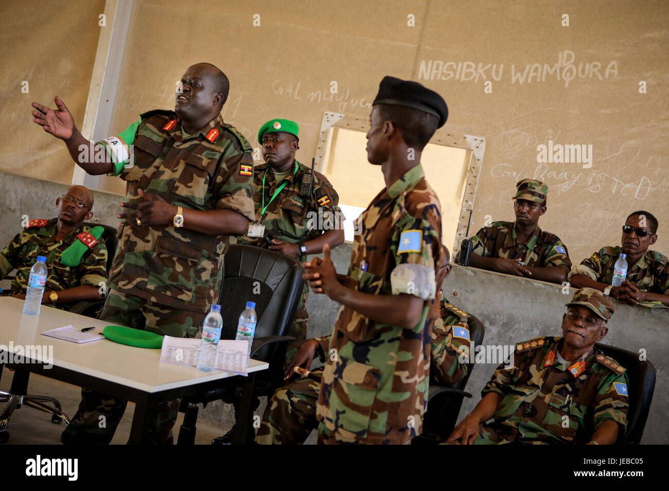 The image depicts the graduation ceremony of the SNA (Senior Naval ...