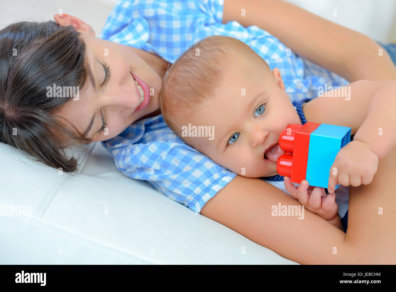 mum and baby boy girl together Stock Photo - Alamy