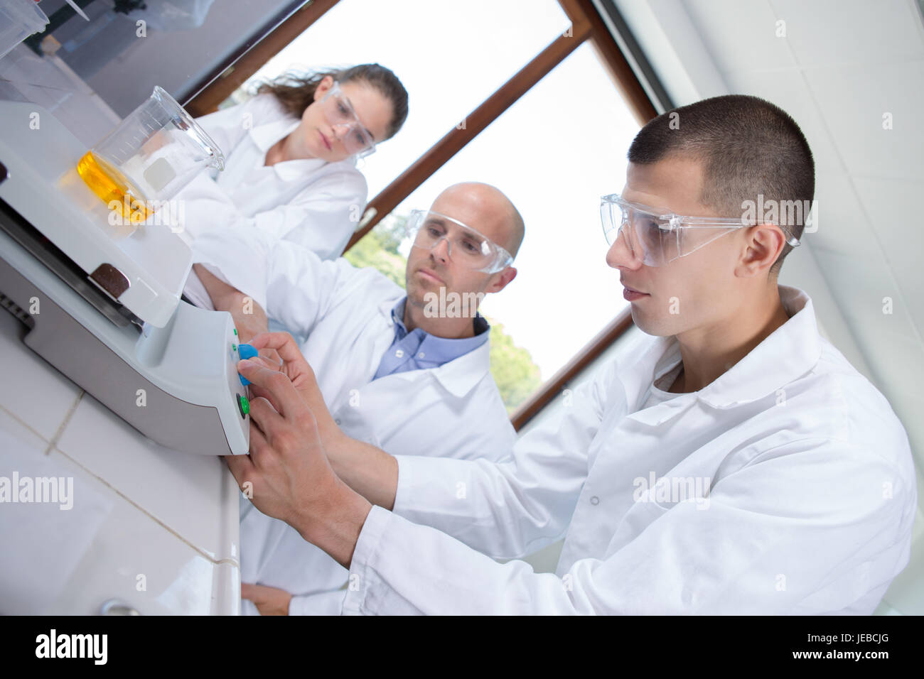 young caucasian scientists studying a molecular structure in a ...