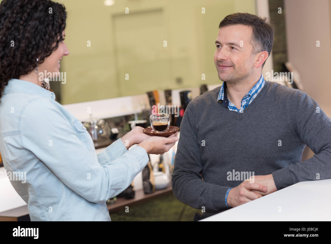 Female waiting drinks coffee hi-res stock photography and images - Alamy